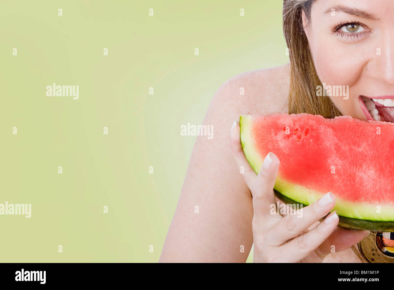 Woman eating watermelon Stock Photo - Alamy