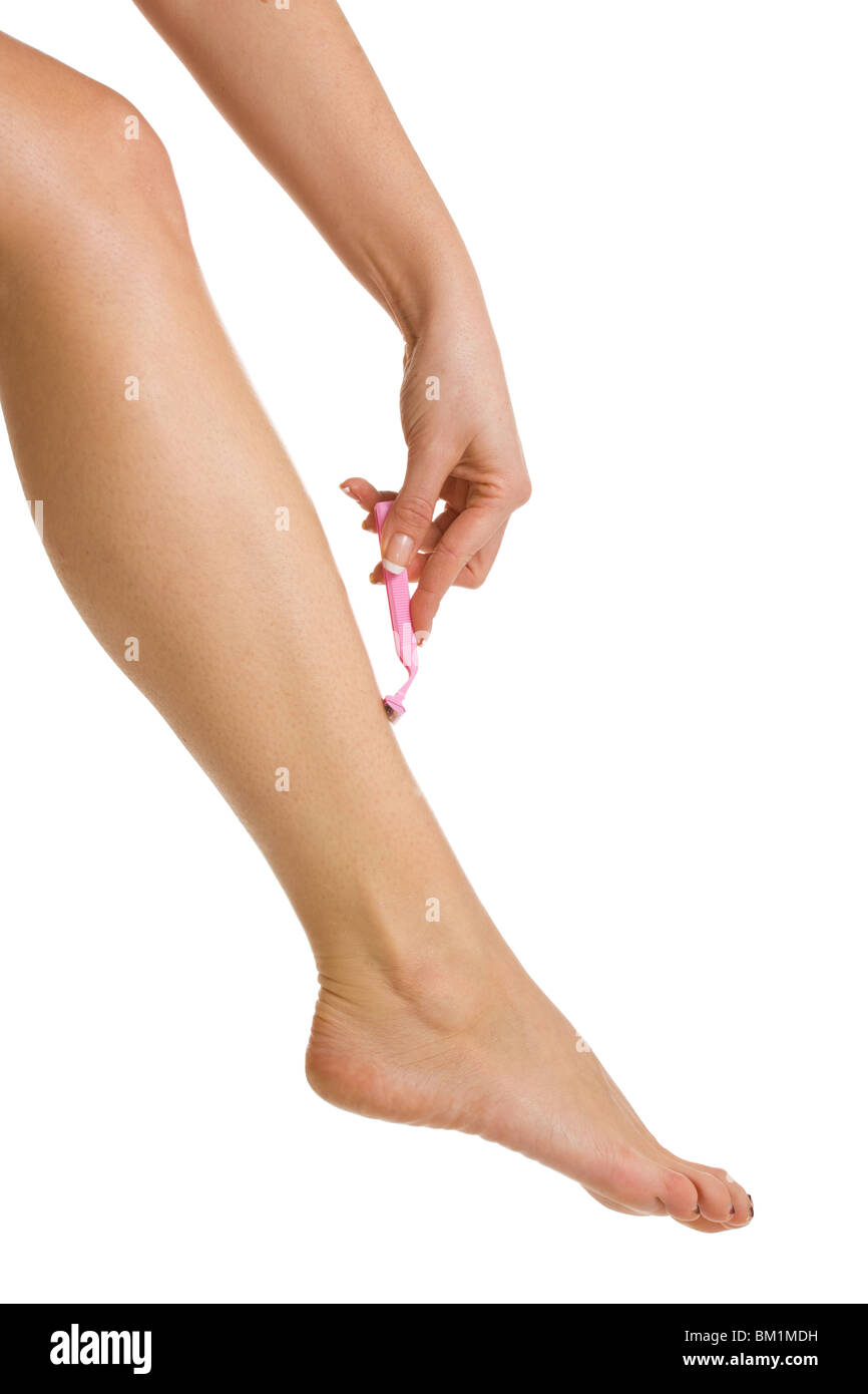 Woman shaving leg Stock Photo - Alamy
