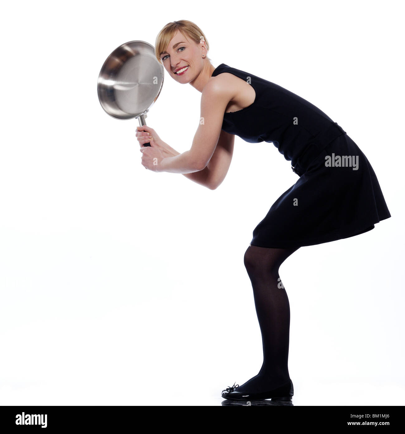 beautiful woman on studio white background holding a frying pan Stock ...
