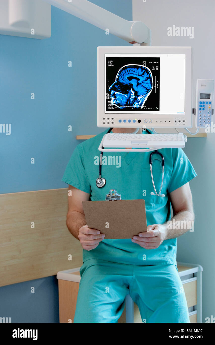 MRI scan of brain on a computer screen with a surgeon sitting behind it ...