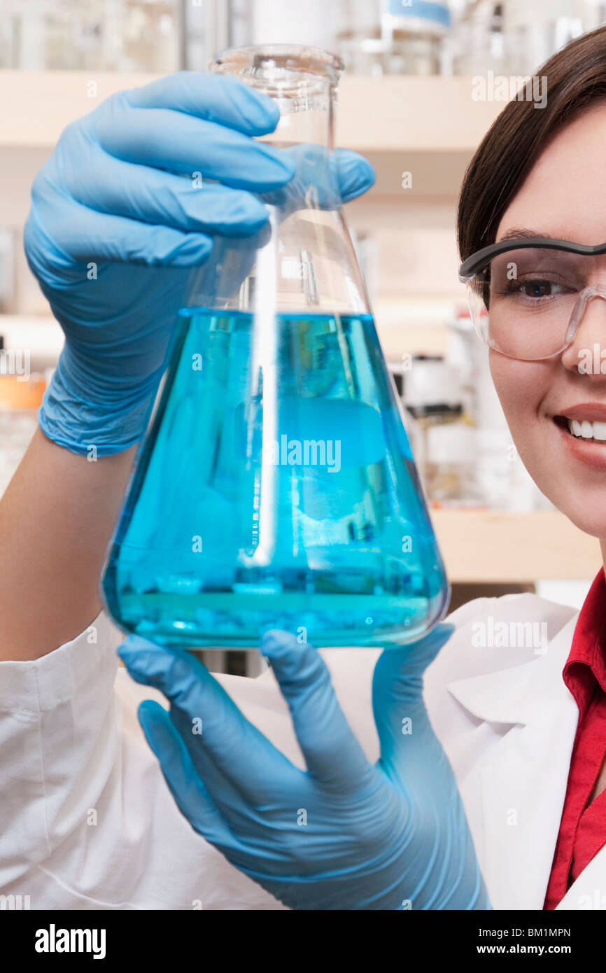 Close up of looking at liquid in conical flask hi-res stock photography ...