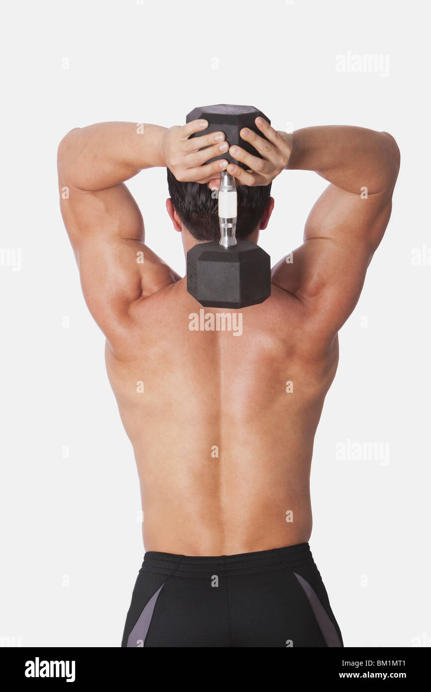 Man exercising with a dumbbell Stock Photo - Alamy