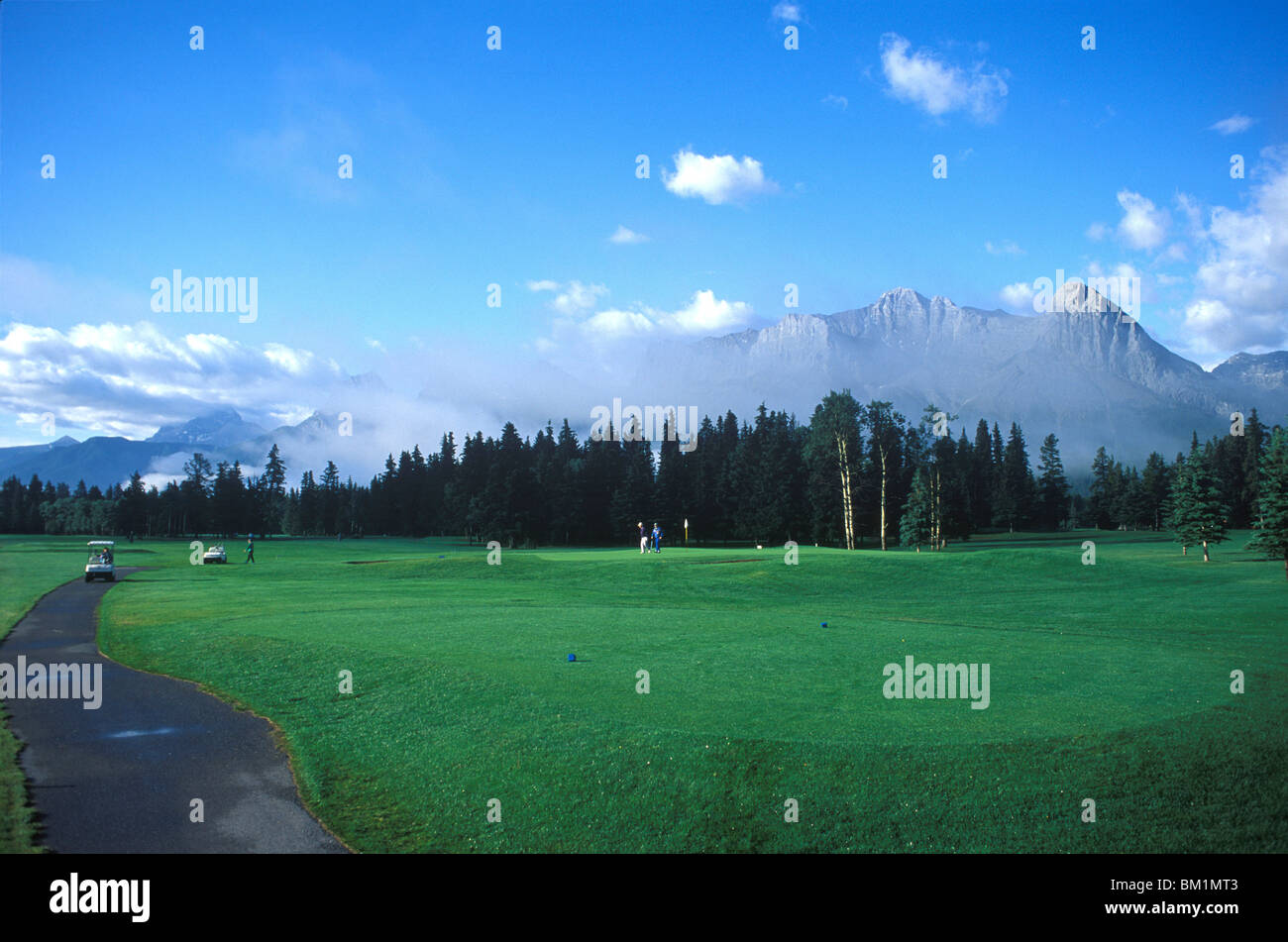 Canmore Golf Course and Three Sisters Mountain behind CANADA Alberta ...