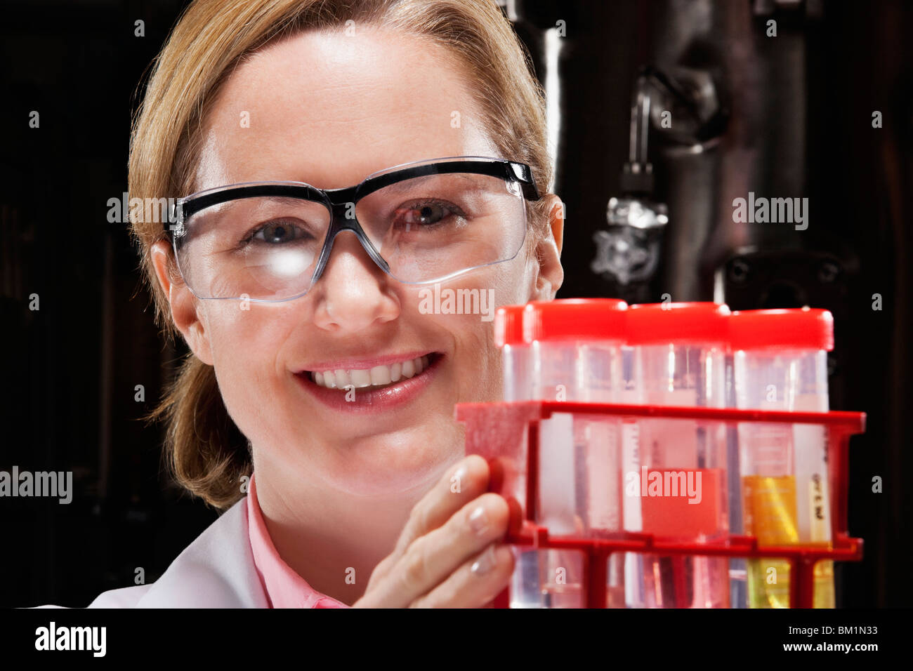 Female doctor holding medical samples in a laboratory Stock Photo - Alamy
