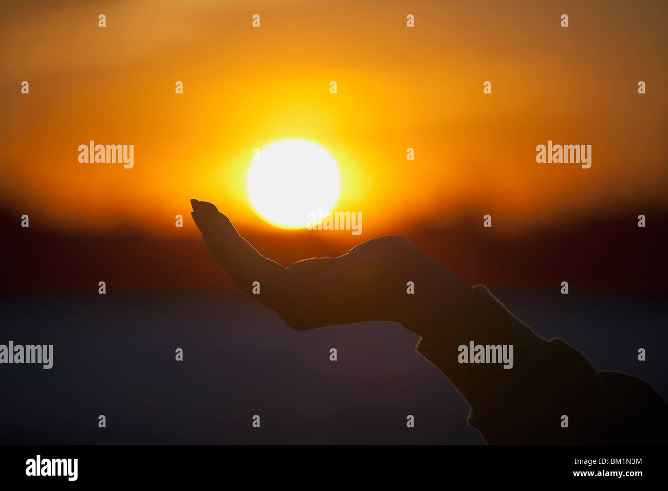 Cupping the sun and silhouette hi-res stock photography and images - Alamy