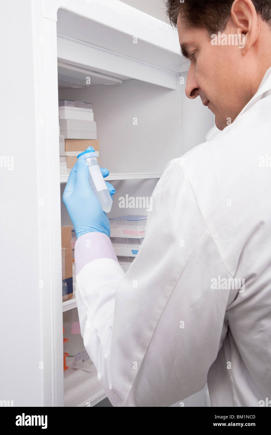 Doctor holding a medical sample in a laboratory Stock Photo - Alamy