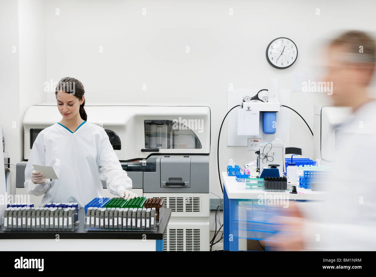 Female doctor examining a report in a laboratory Stock Photo - Alamy