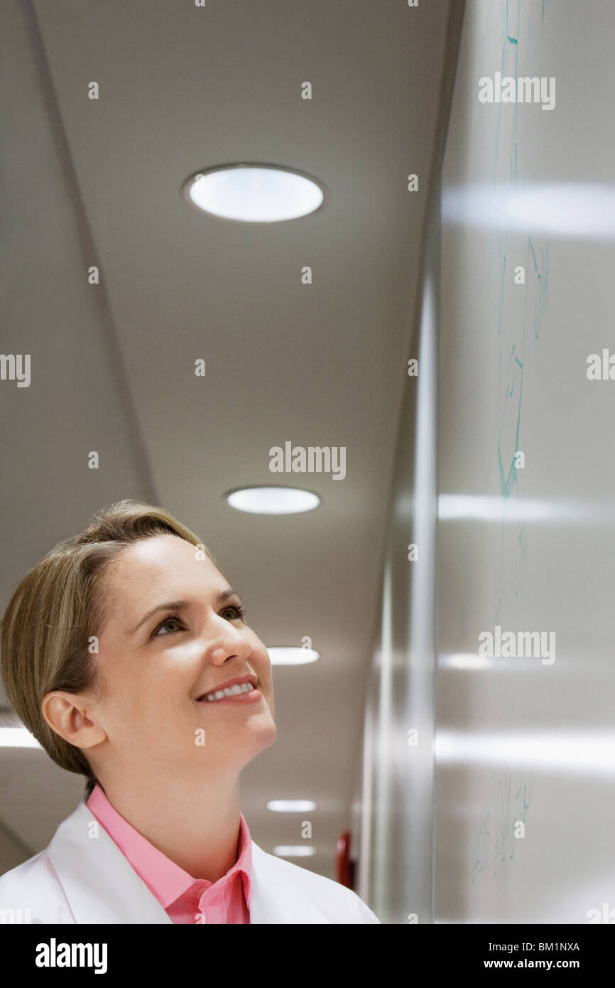 Female doctor looking at a whiteboard Stock Photo - Alamy