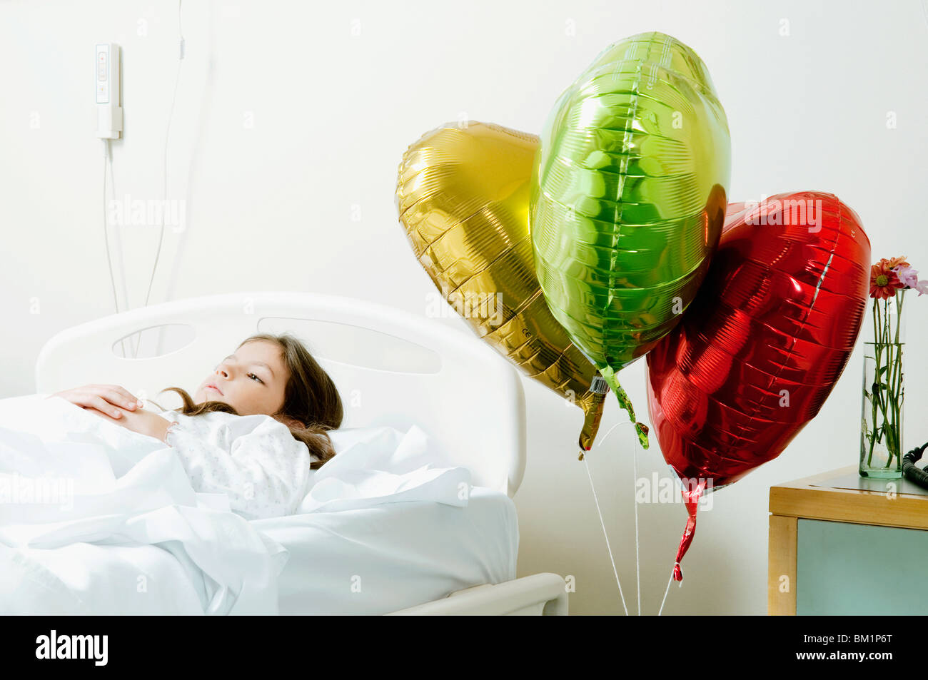 Girl balloons on hospital bed hi-res stock photography and images - Alamy