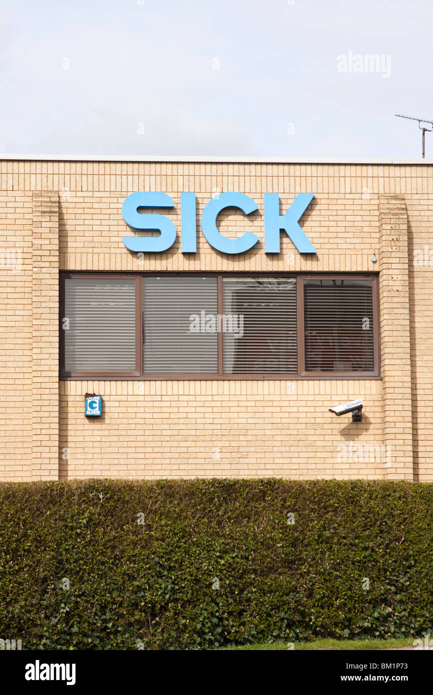 Office building with large Sick lettering on side Stock Photo - Alamy