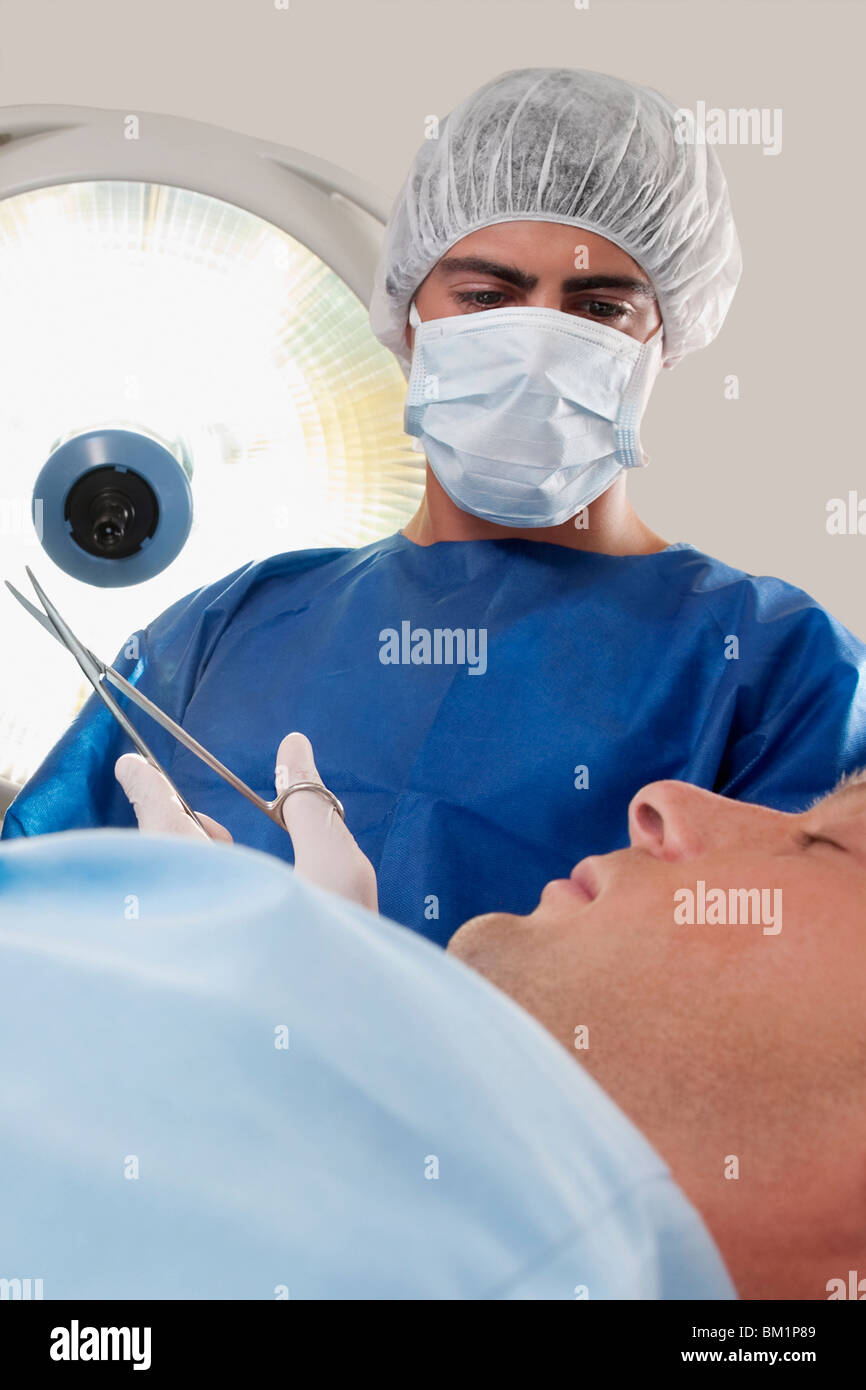 Male surgeon looking unconscious hi-res stock photography and images ...