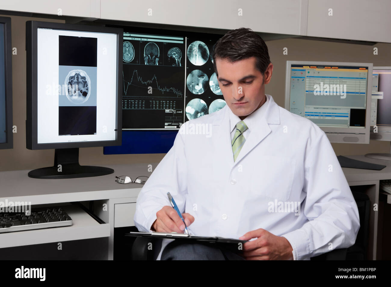 Doctor thinking writing on paper hi-res stock photography and images ...