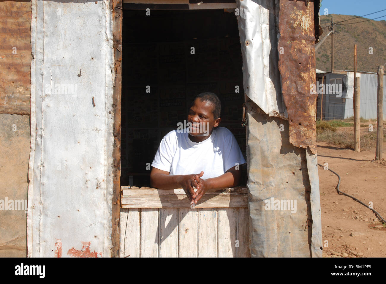 Woman in her shack Stock Photo - Alamy