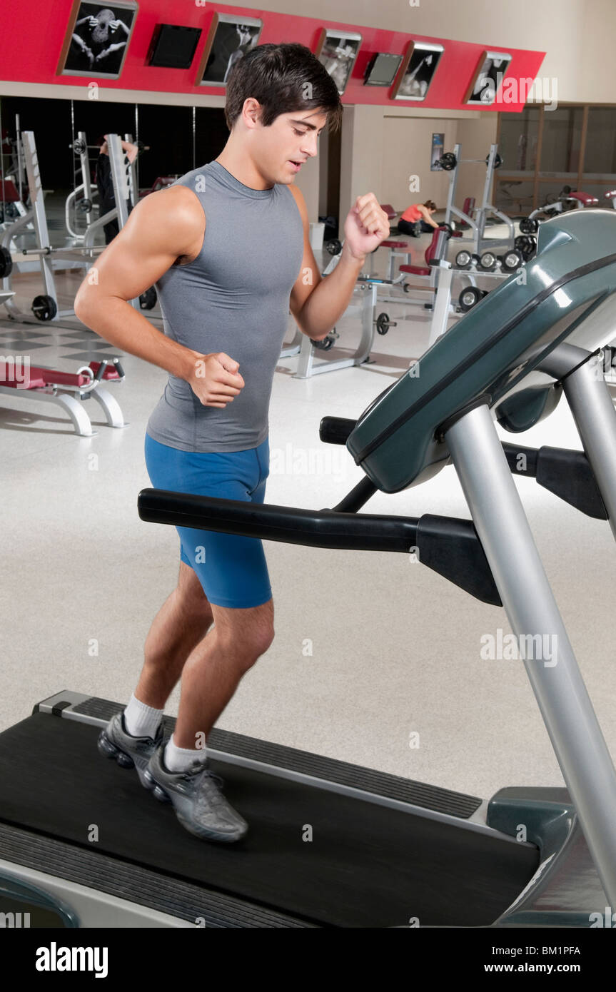 Man running on a treadmill Stock Photo - Alamy
