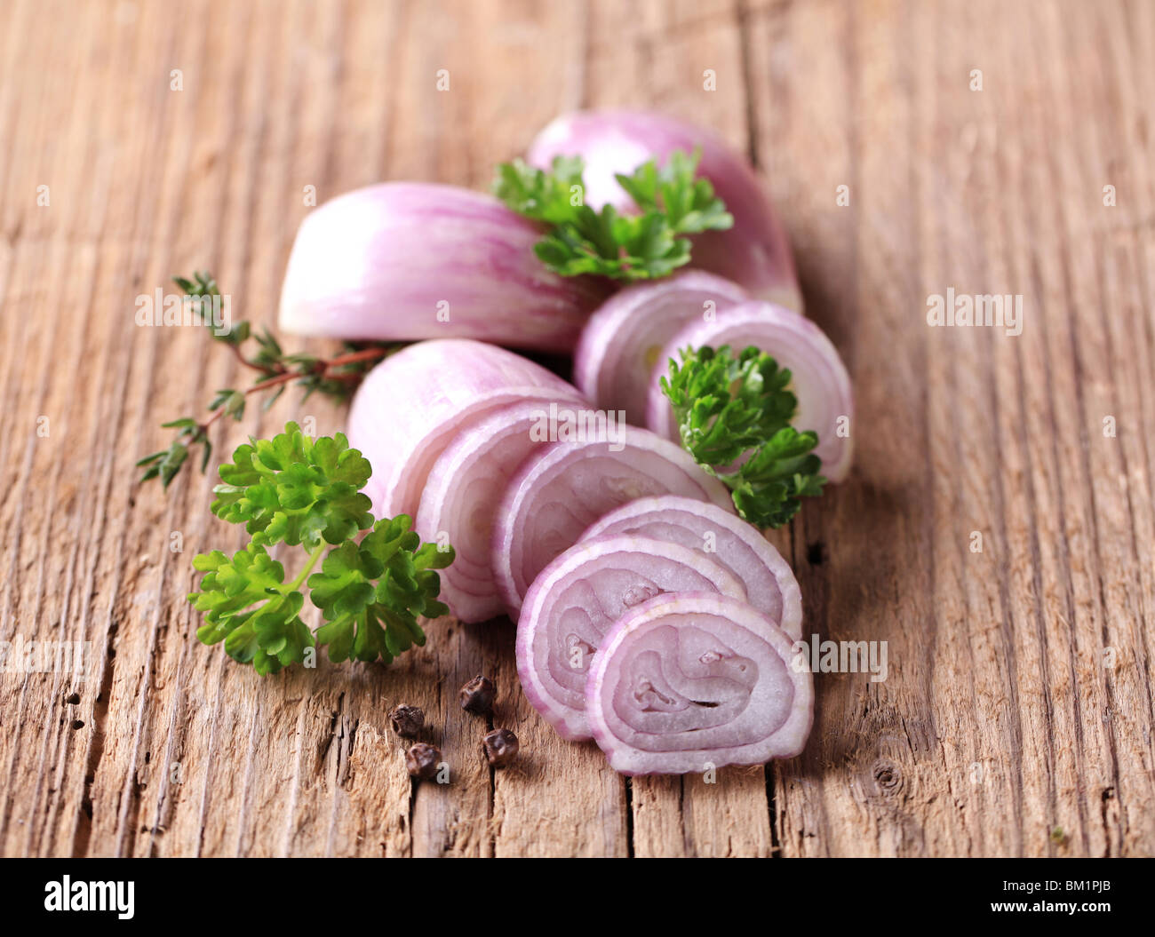 Raw red onion cut into slices Stock Photo - Alamy