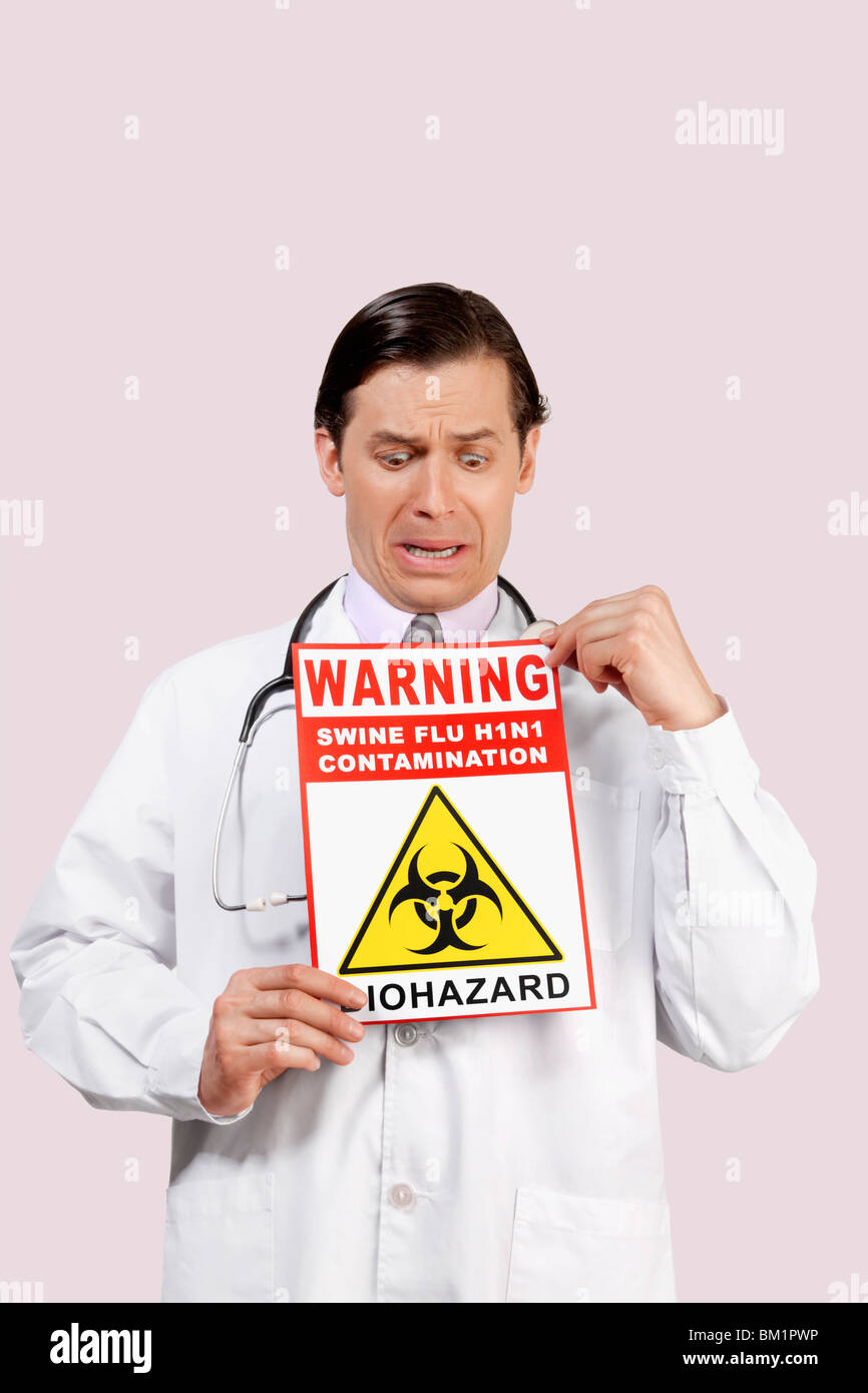 Doctor showing a Biohazard warning sign and crying Stock Photo - Alamy