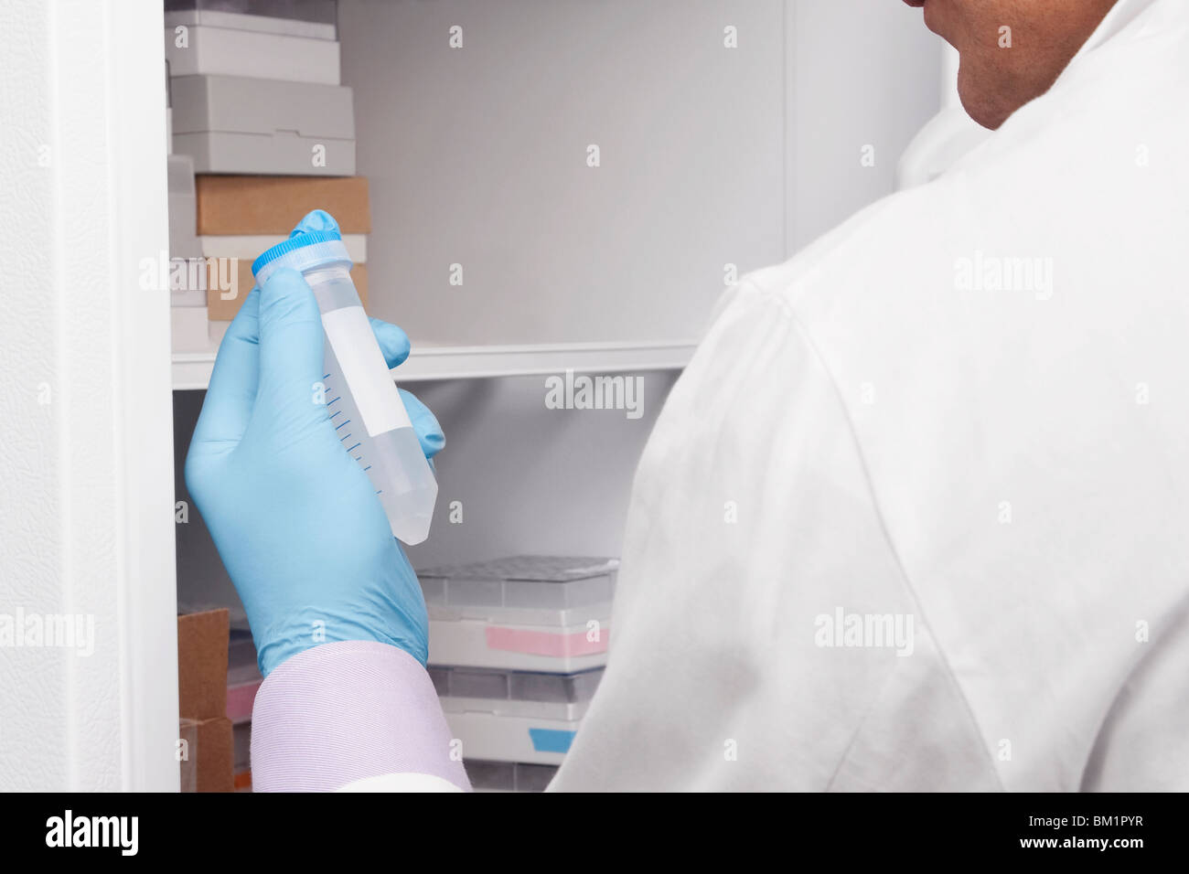 Doctor holding a medical sample in a laboratory Stock Photo - Alamy