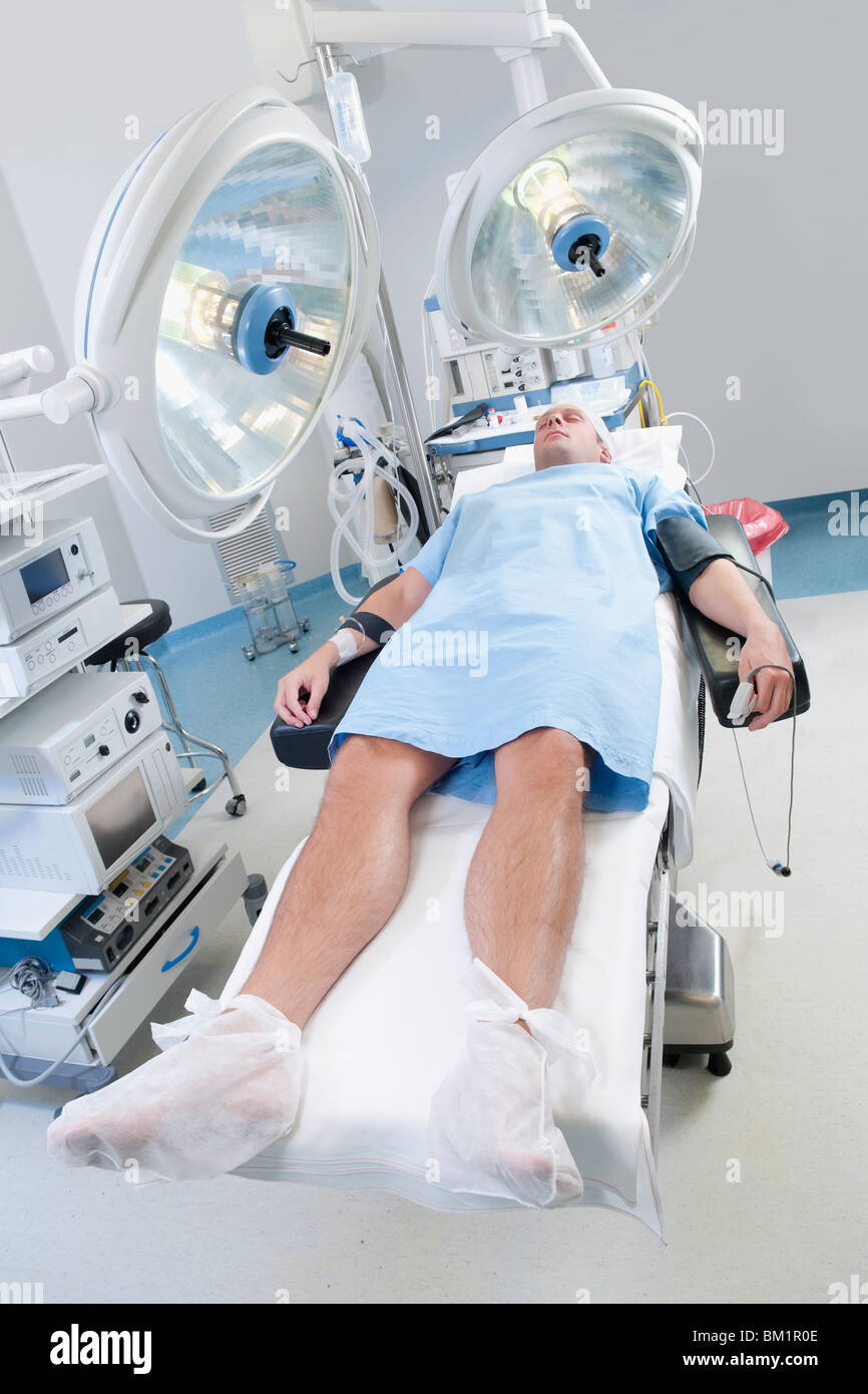 Patient lying down on an examination table hi-res stock photography and ...