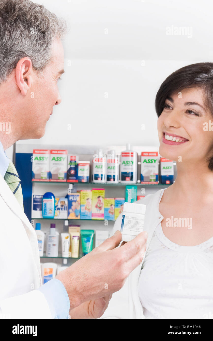 Woman chemist talking pharmacist hi-res stock photography and images ...