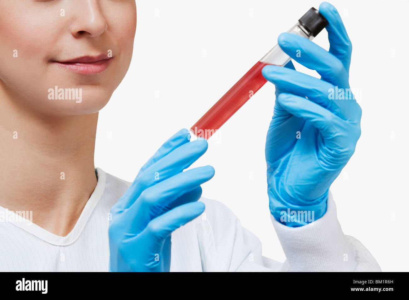 Female doctor holding a medical sample in a laboratory Stock Photo - Alamy