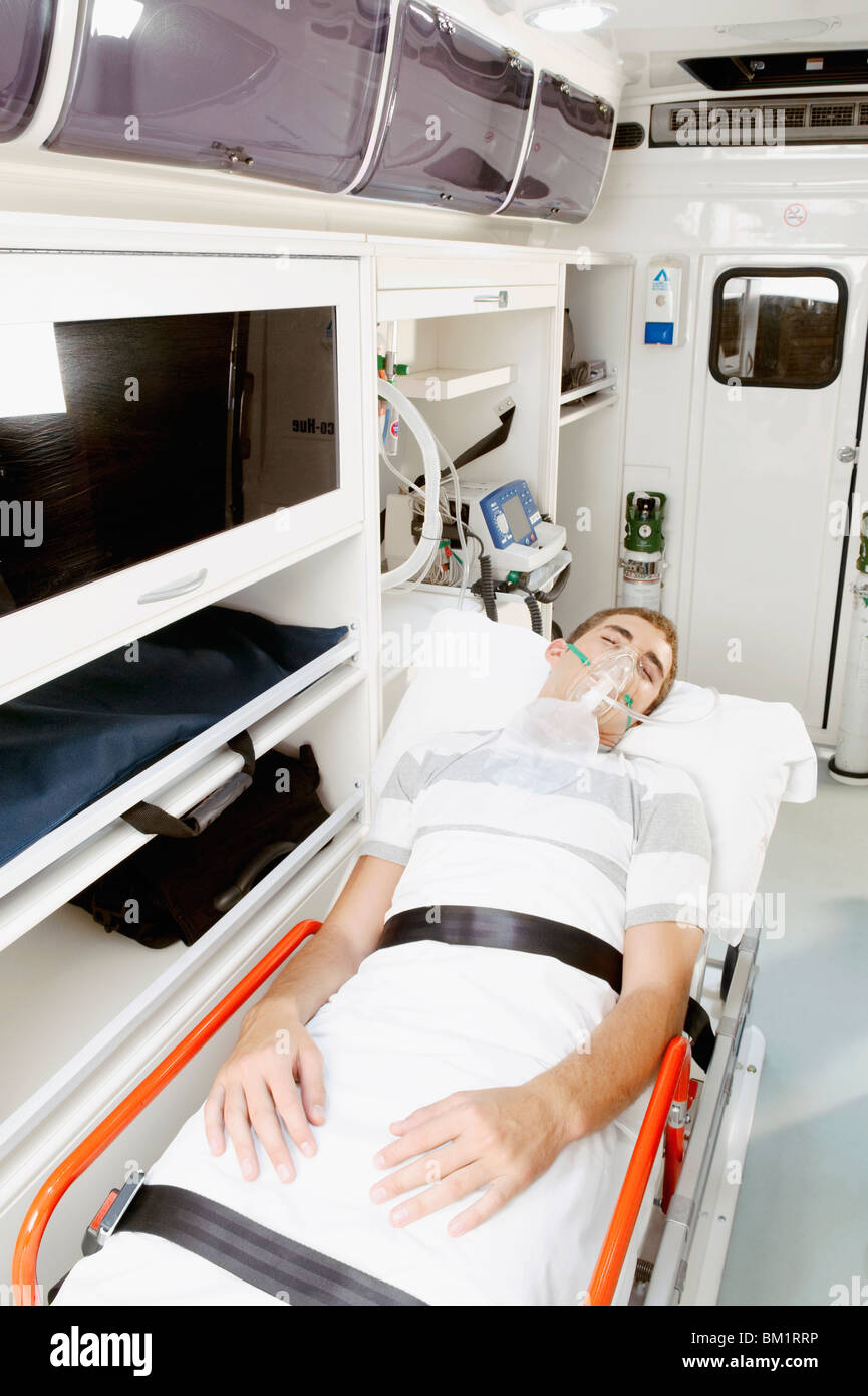 Patient lying in an ambulance Stock Photo - Alamy