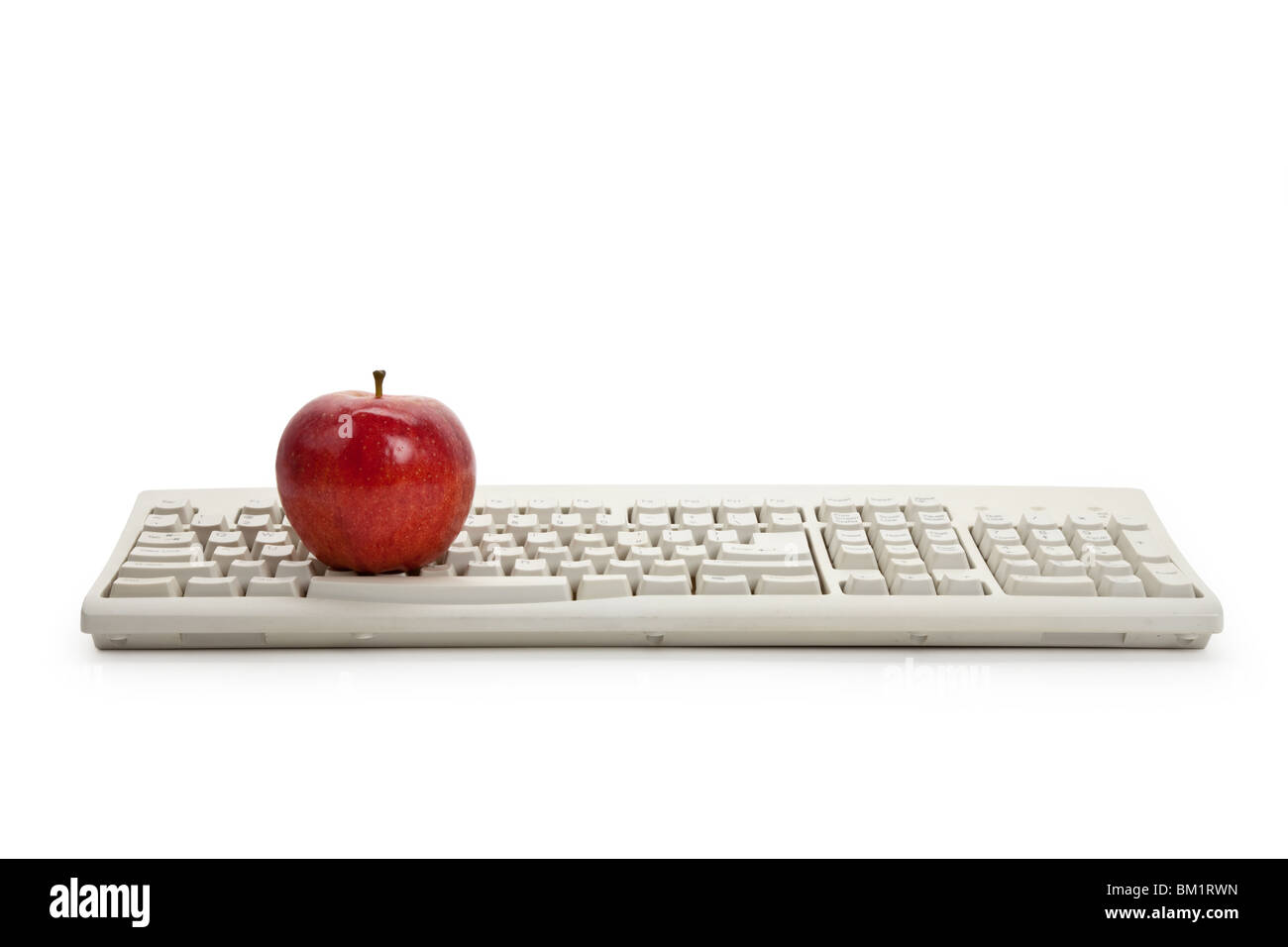 Computer Keyboard and red apple close up Stock Photo - Alamy