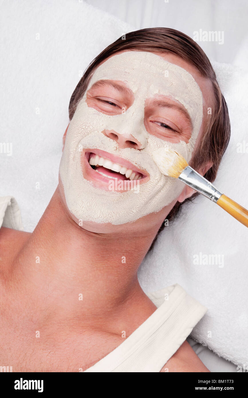 Man applying face pack Stock Photo - Alamy
