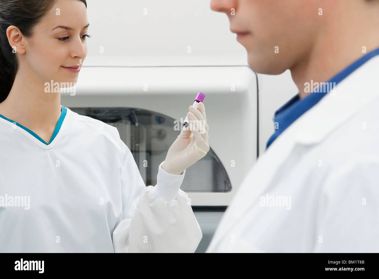 Female doctor holding a medical sample in a laboratory Stock Photo - Alamy