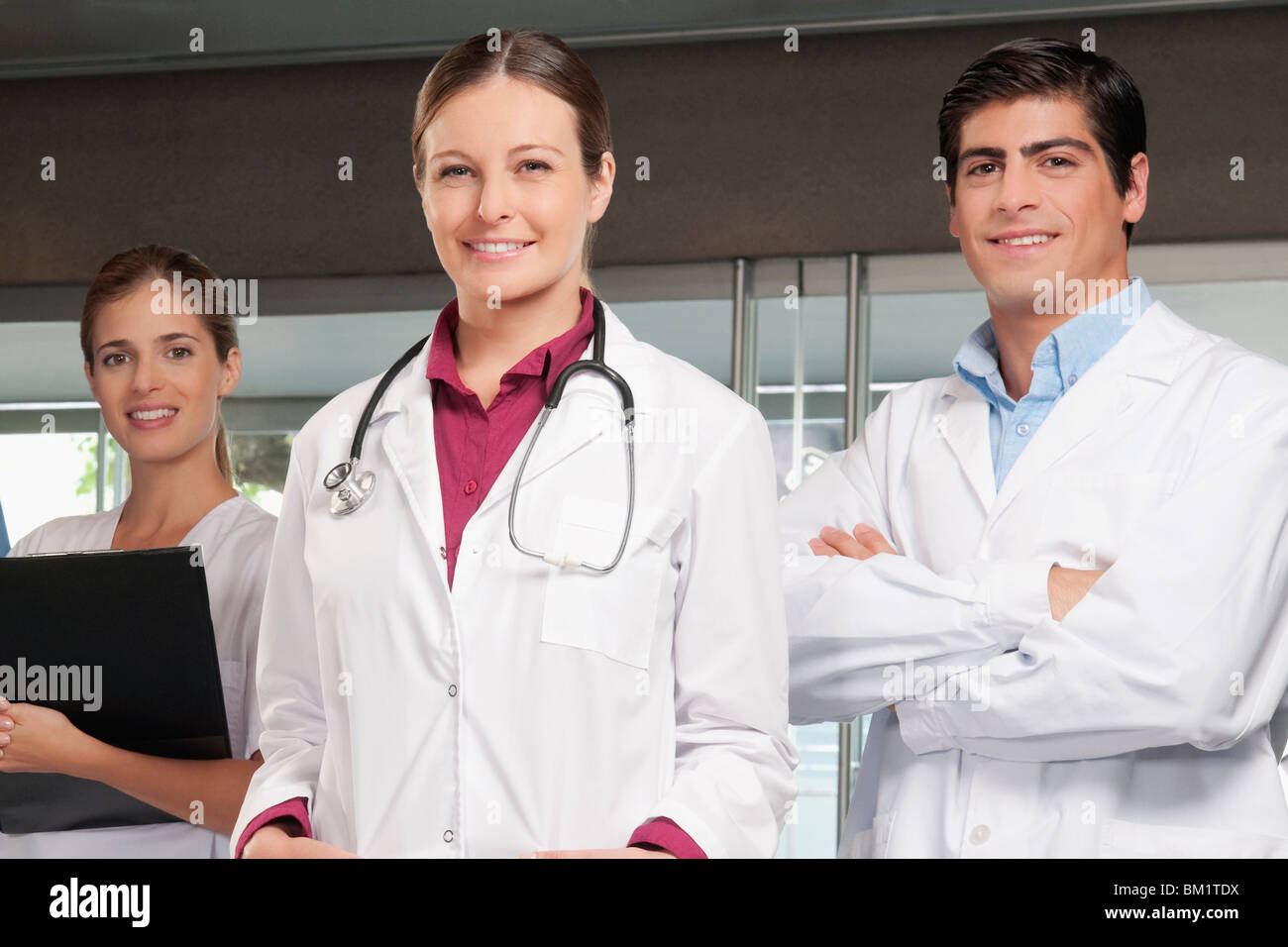 Three doctors standing together Stock Photo - Alamy