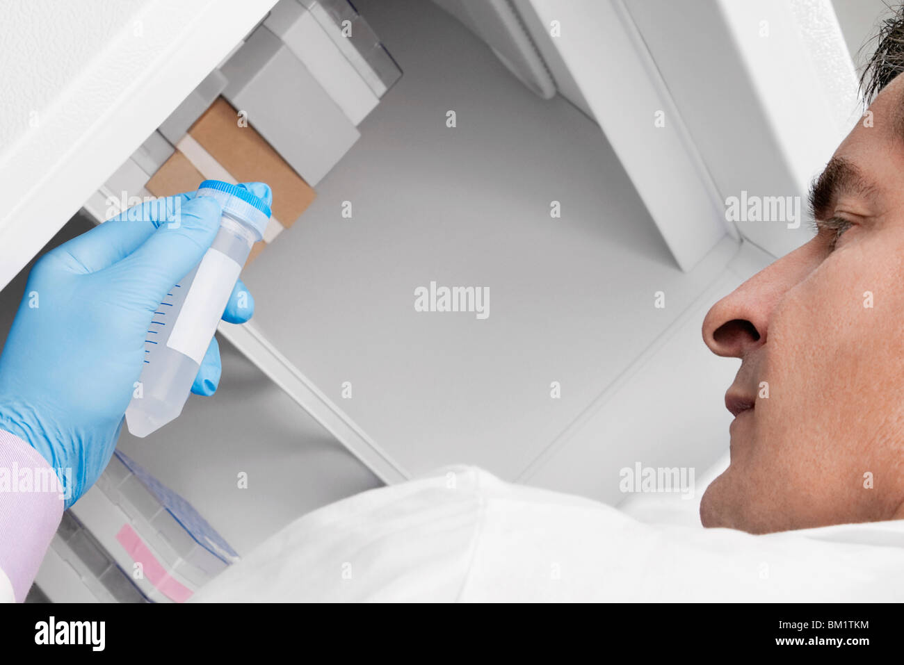 Doctor holding a medical sample in a laboratory Stock Photo - Alamy