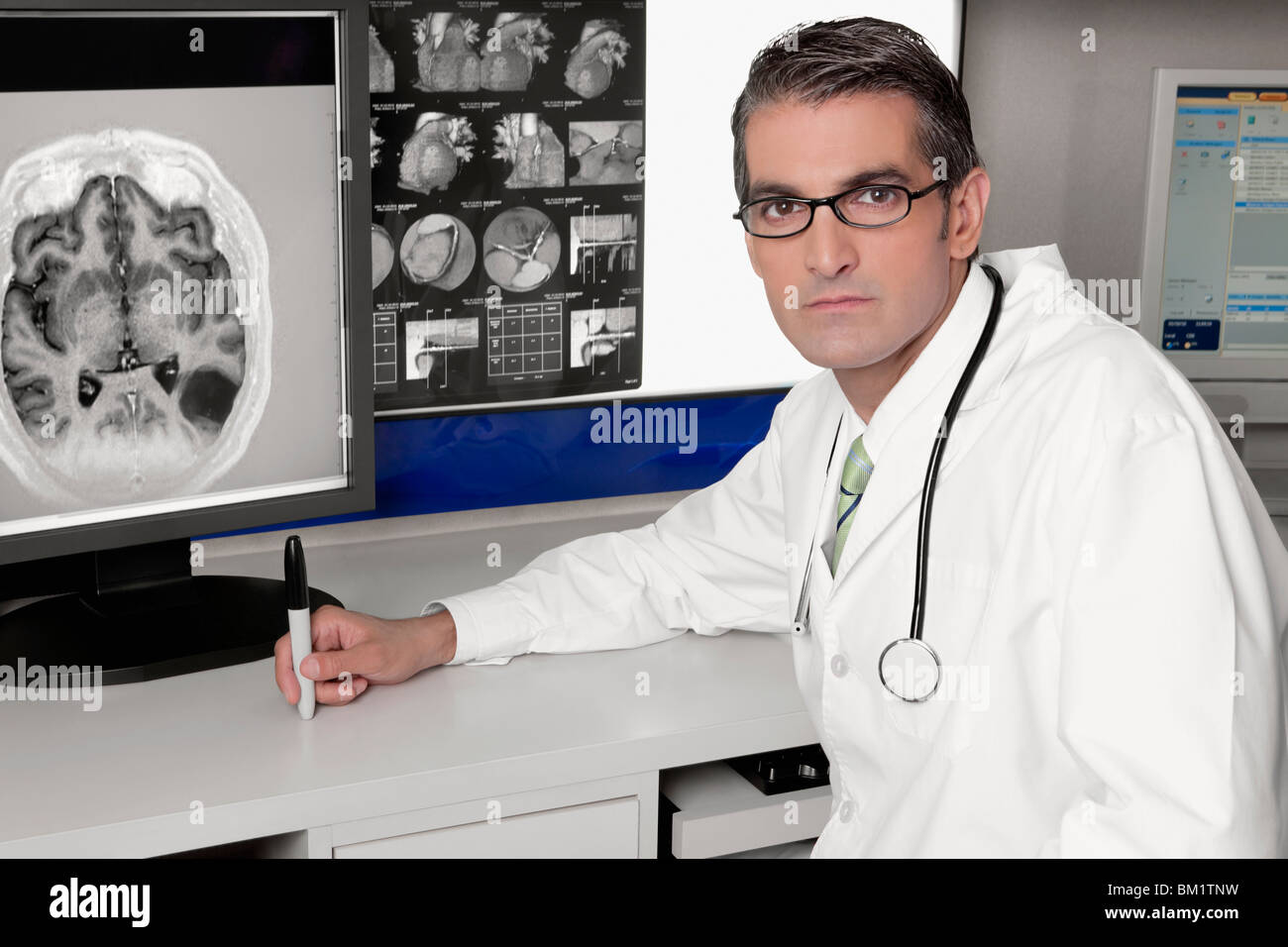 Portrait of a doctor with MRI report Stock Photo - Alamy