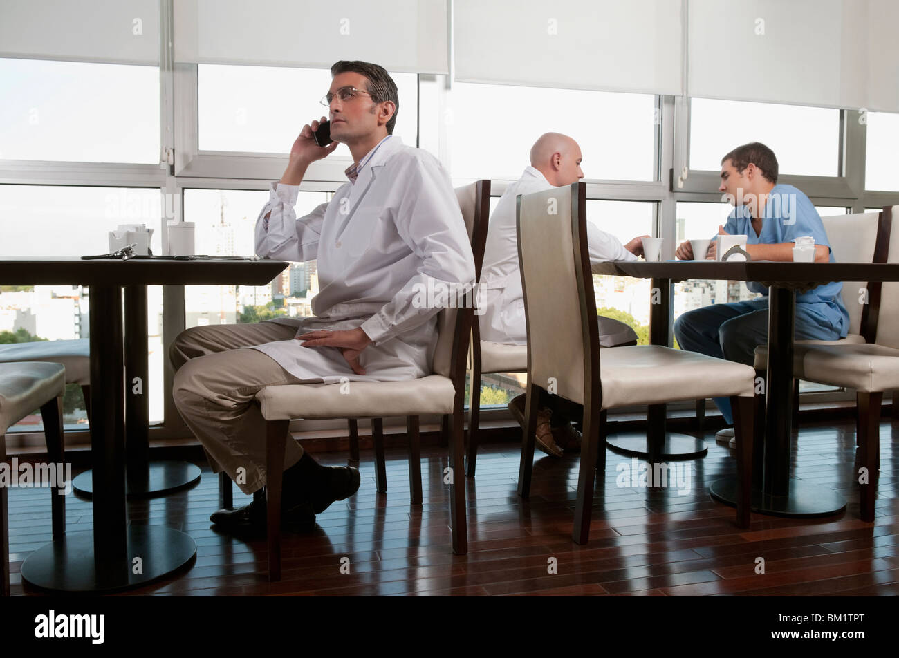 Doctors during coffee break a cafeteria Stock Photo - Alamy