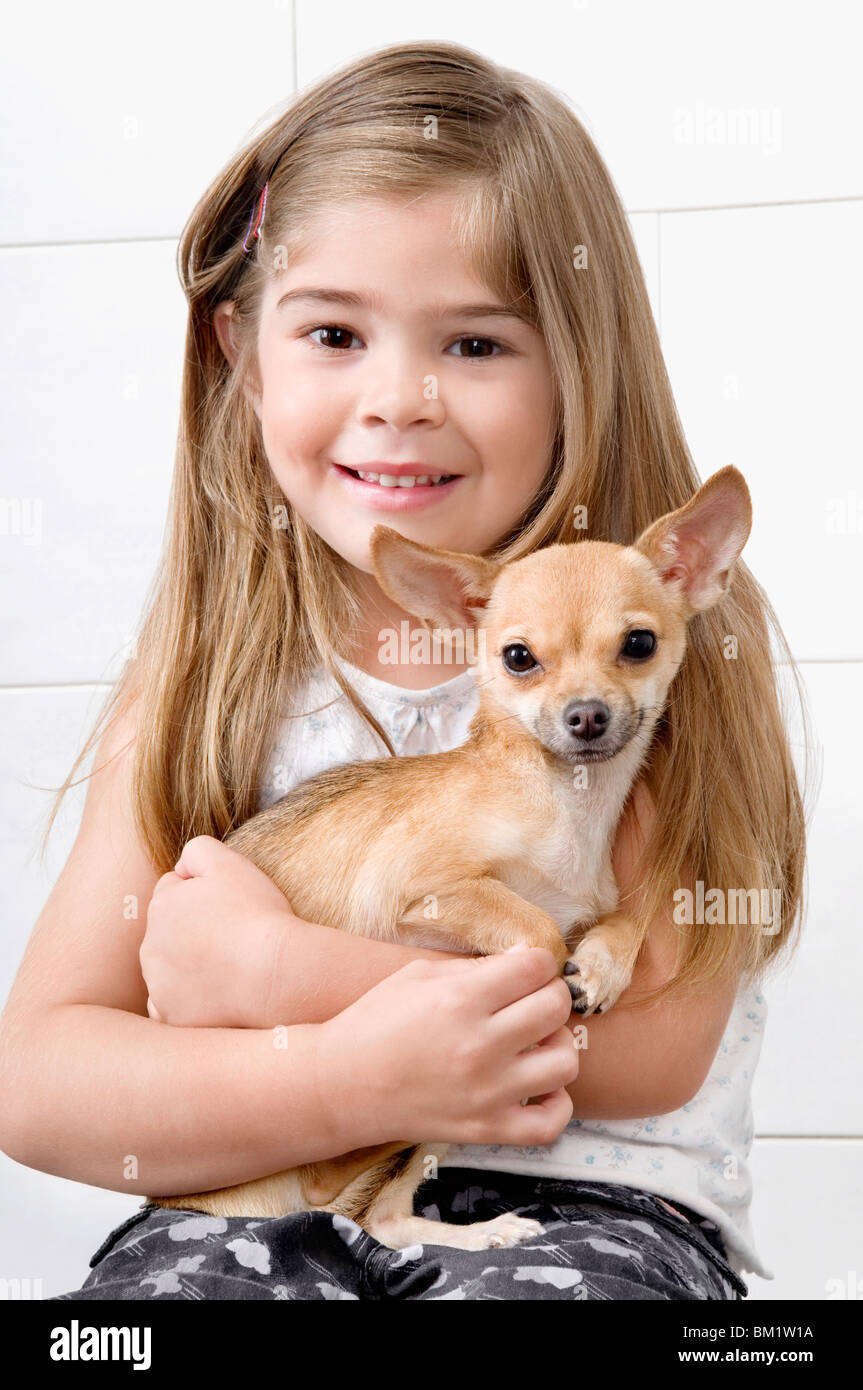 Girl carrying a puppy hi-res stock photography and images - Alamy