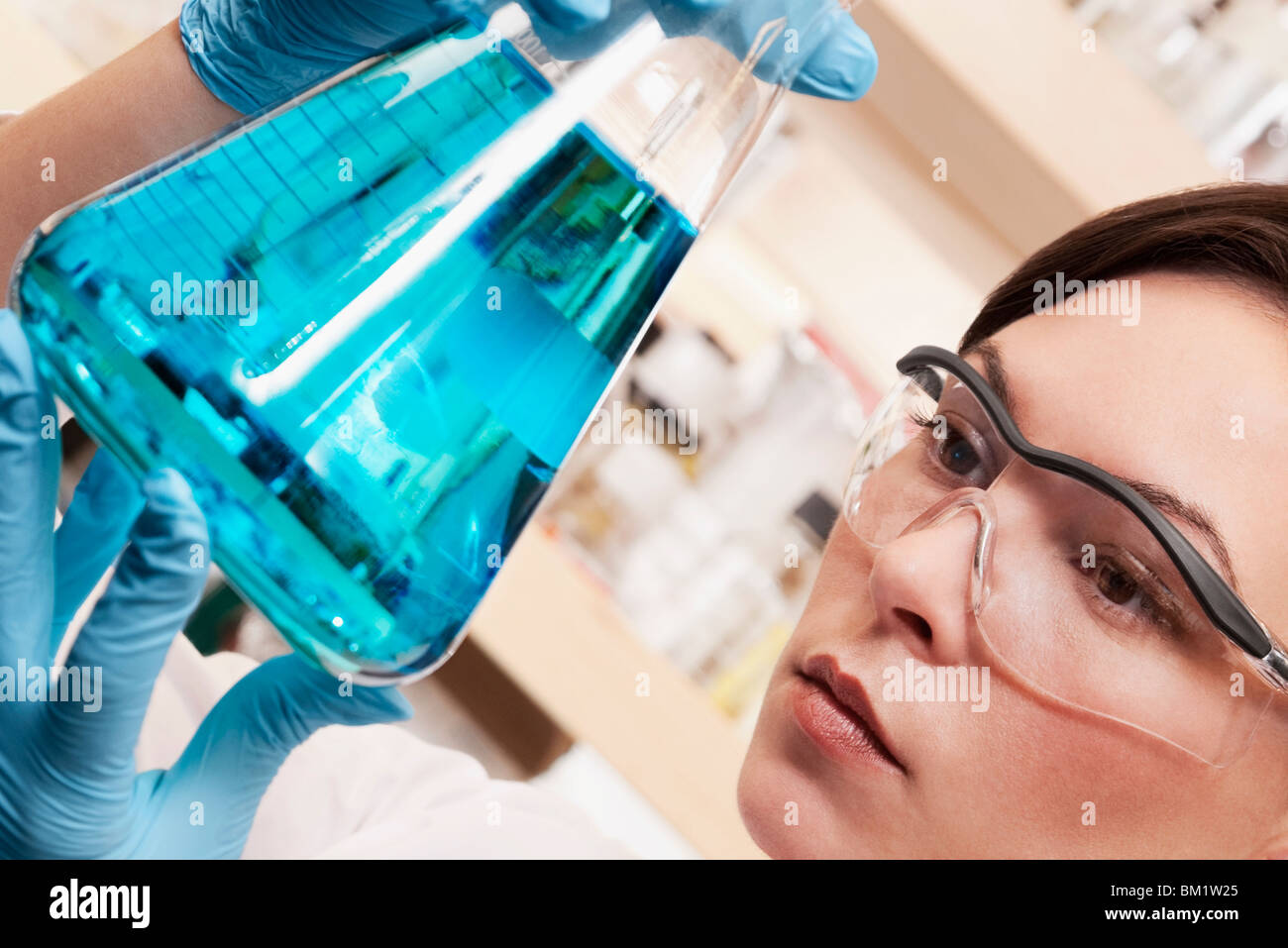 Female doctor holding a conical flask in a laboratory Stock Photo - Alamy