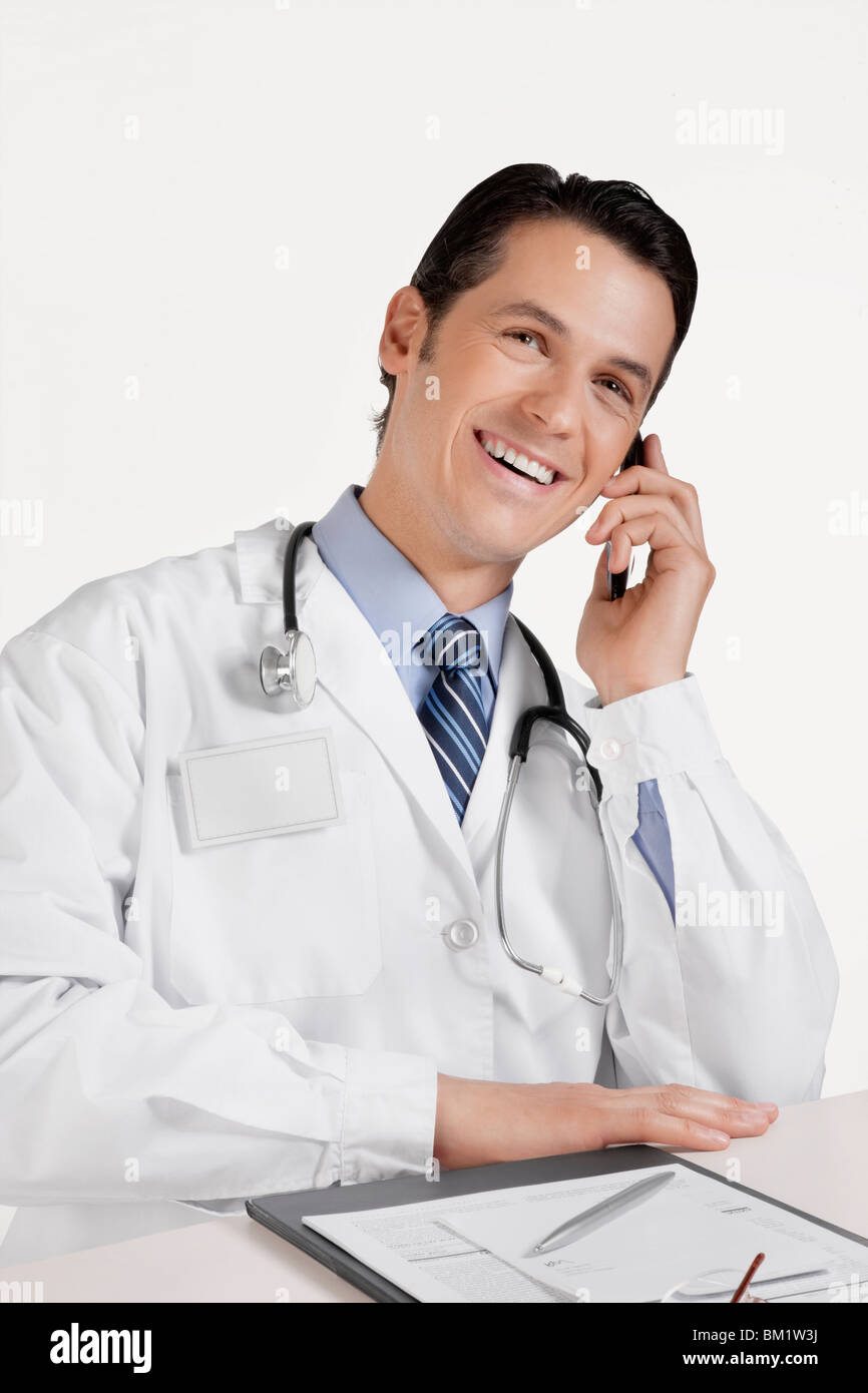 Doctor talking on a mobile phone Stock Photo - Alamy
