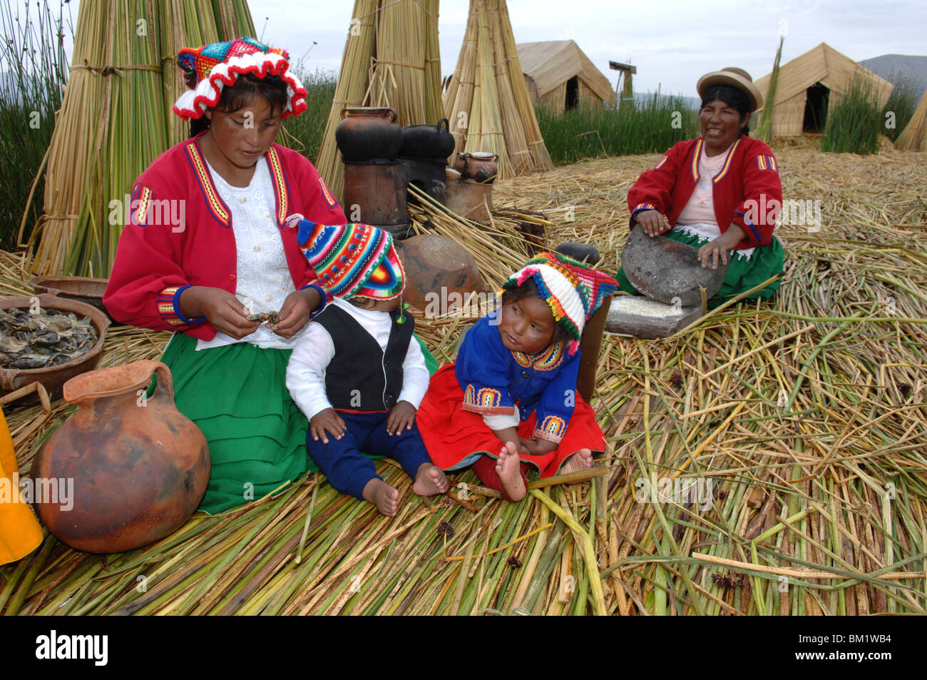 Tribal family, Uros, Lake Titicaca, Puno, Peru Stock Photo - Alamy