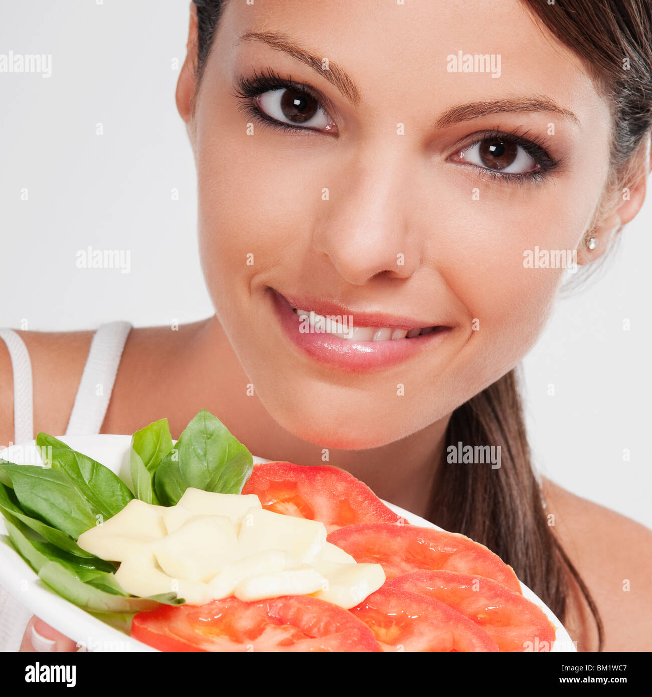 Happy latin woman holding plate hi-res stock photography and images - Alamy