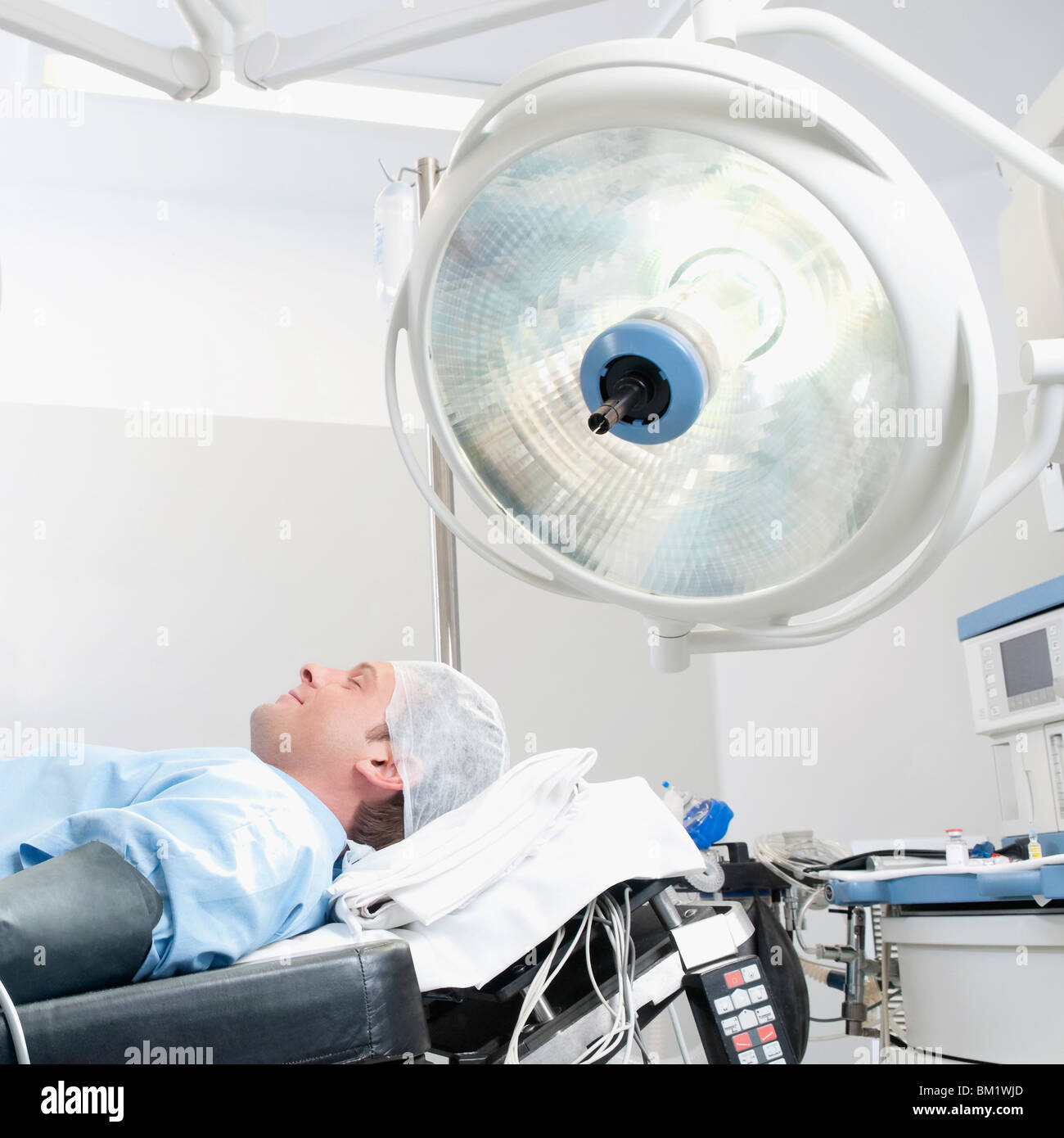 Patient lying down on an examination table hi-res stock photography and ...