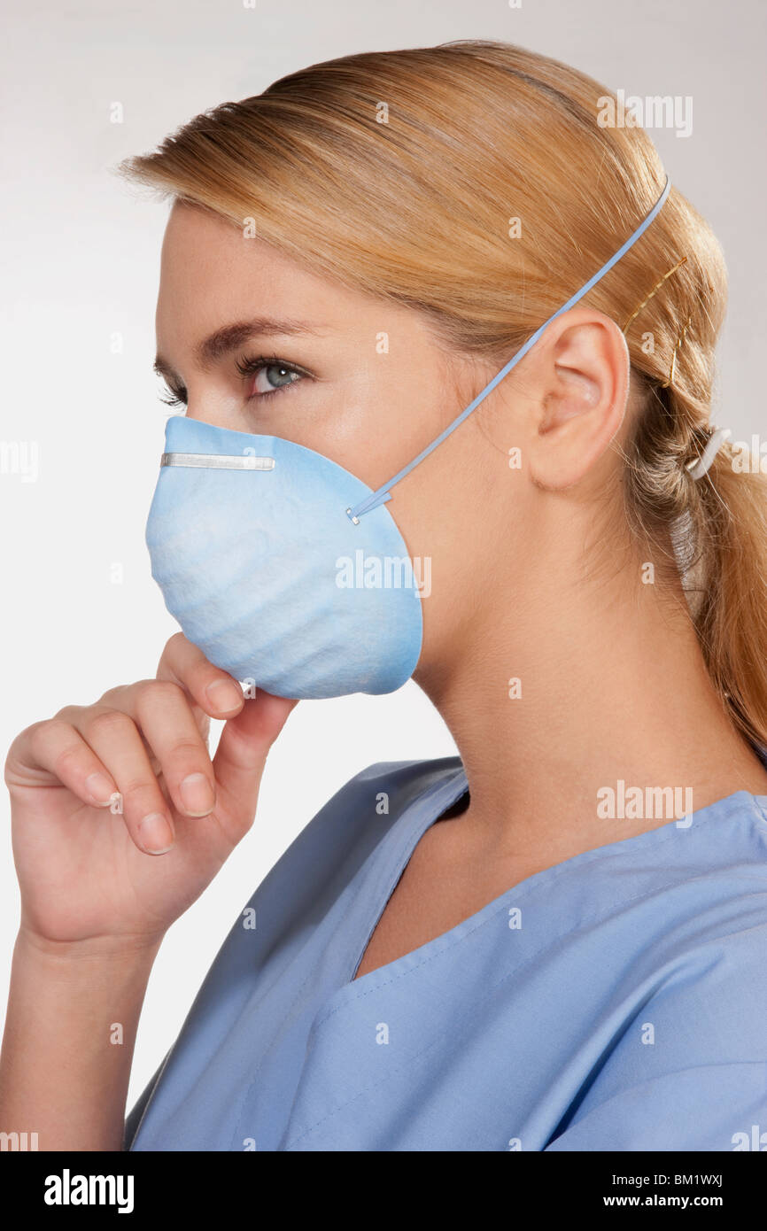 Female doctor wearing a flu mask Stock Photo - Alamy