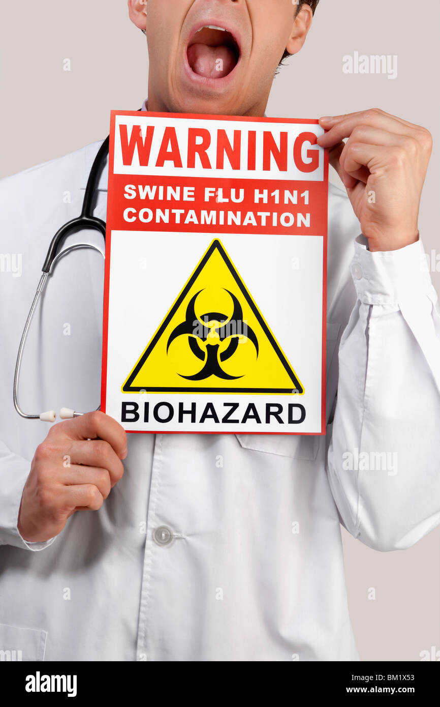 Close-up of a doctor showing a Biohazard warning sign Stock Photo - Alamy
