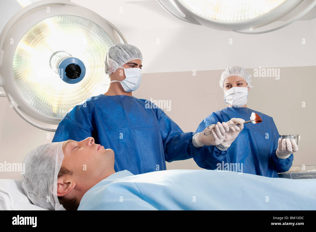 Male patient lying on operating table hi-res stock photography and ...