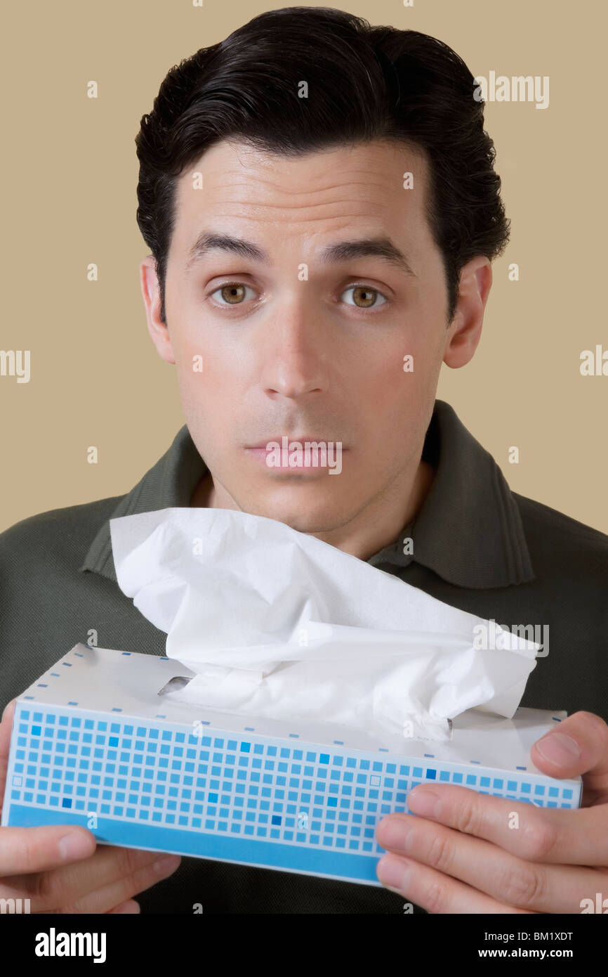 Man holding a tissue paper box Stock Photo - Alamy
