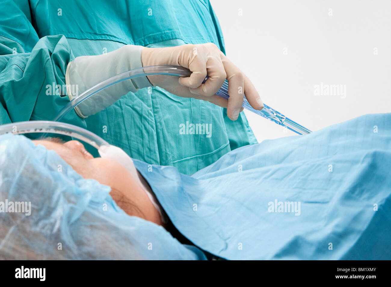 Surgeon performing a surgery in an operating room Stock Photo - Alamy