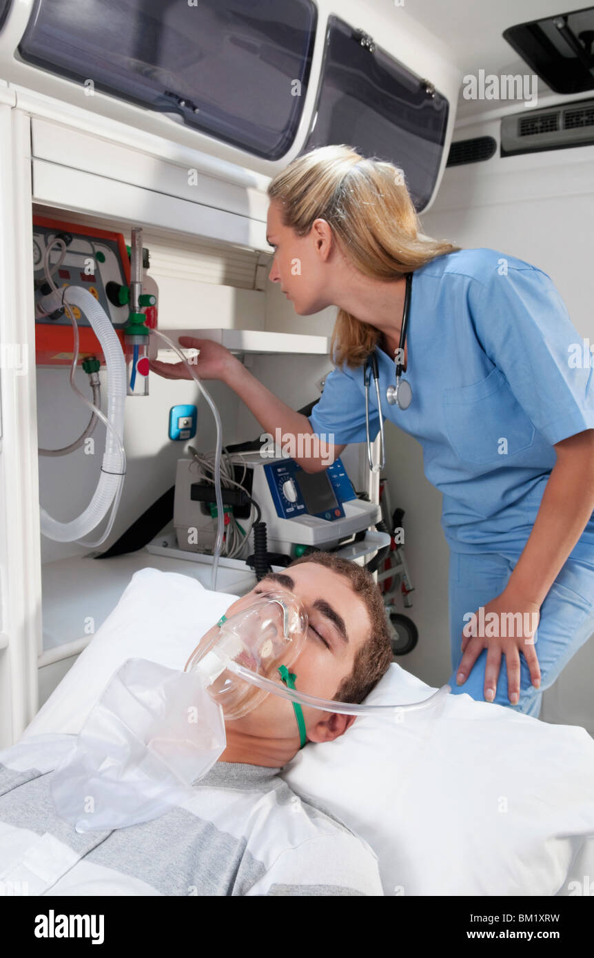 Checking breathing on female patient hi-res stock photography and ...
