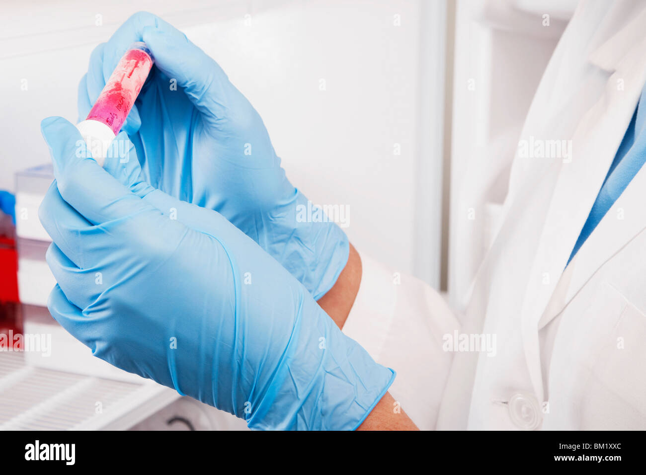Doctor holding a medical sample in a laboratory Stock Photo - Alamy