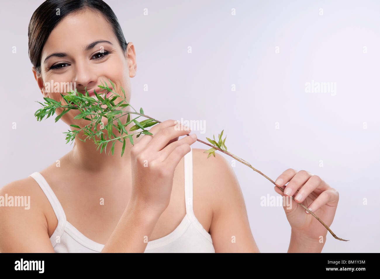 Woman smelling aroma herbs Stock Photo - Alamy