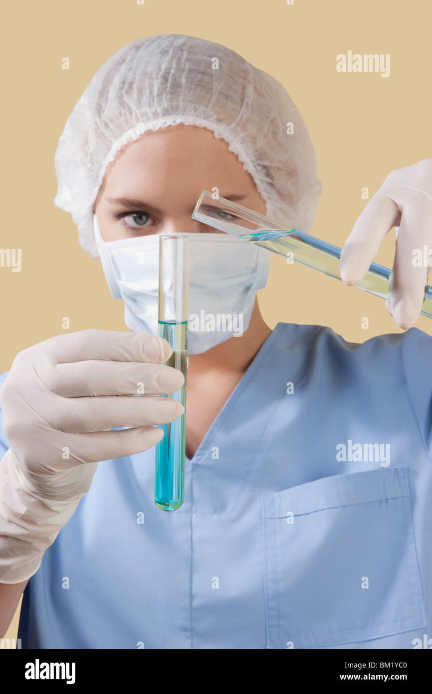 Female lab technician analyzing test tubes Stock Photo - Alamy