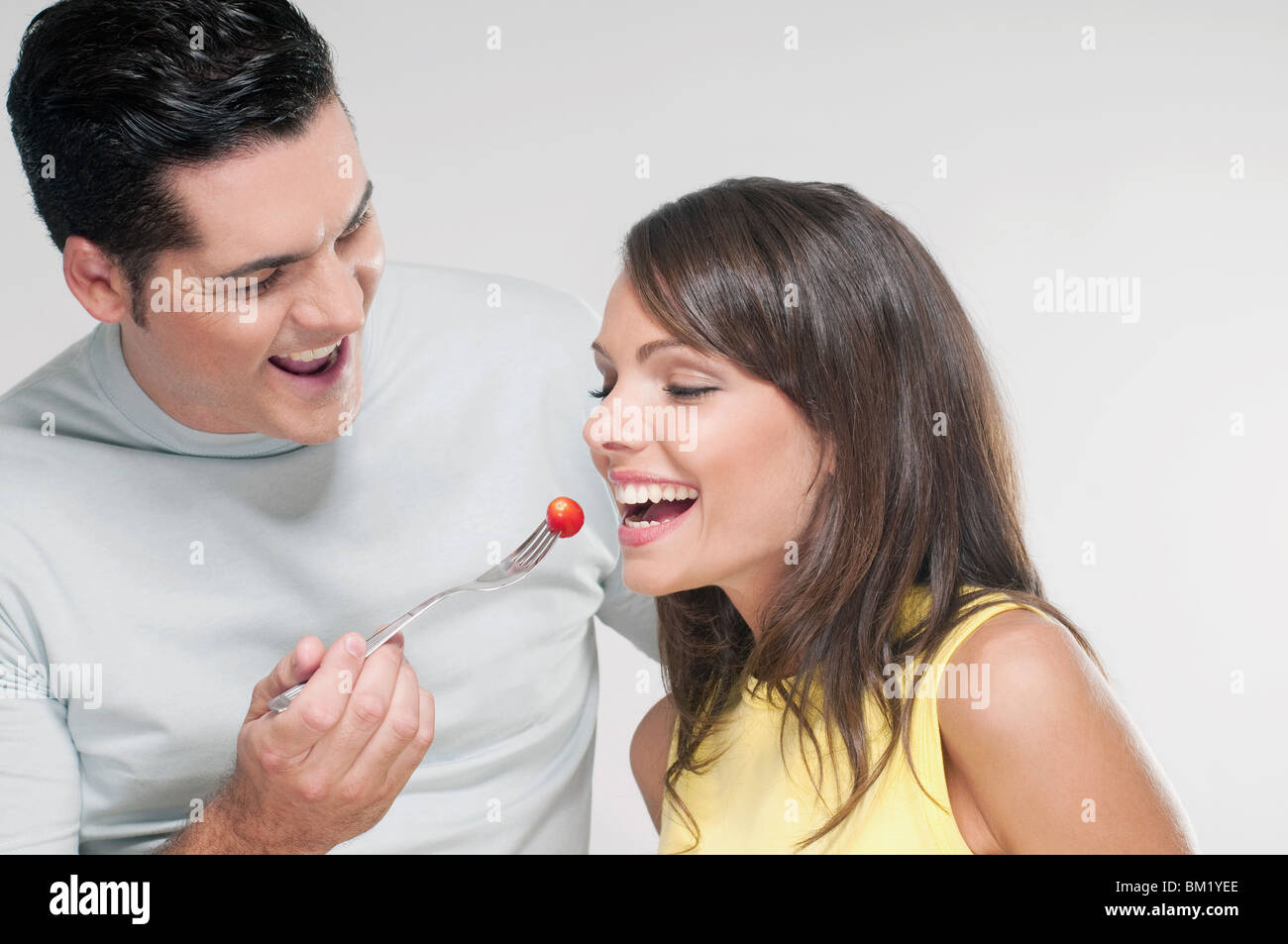 Couple woman feeding man cherry hi-res stock photography and images - Alamy