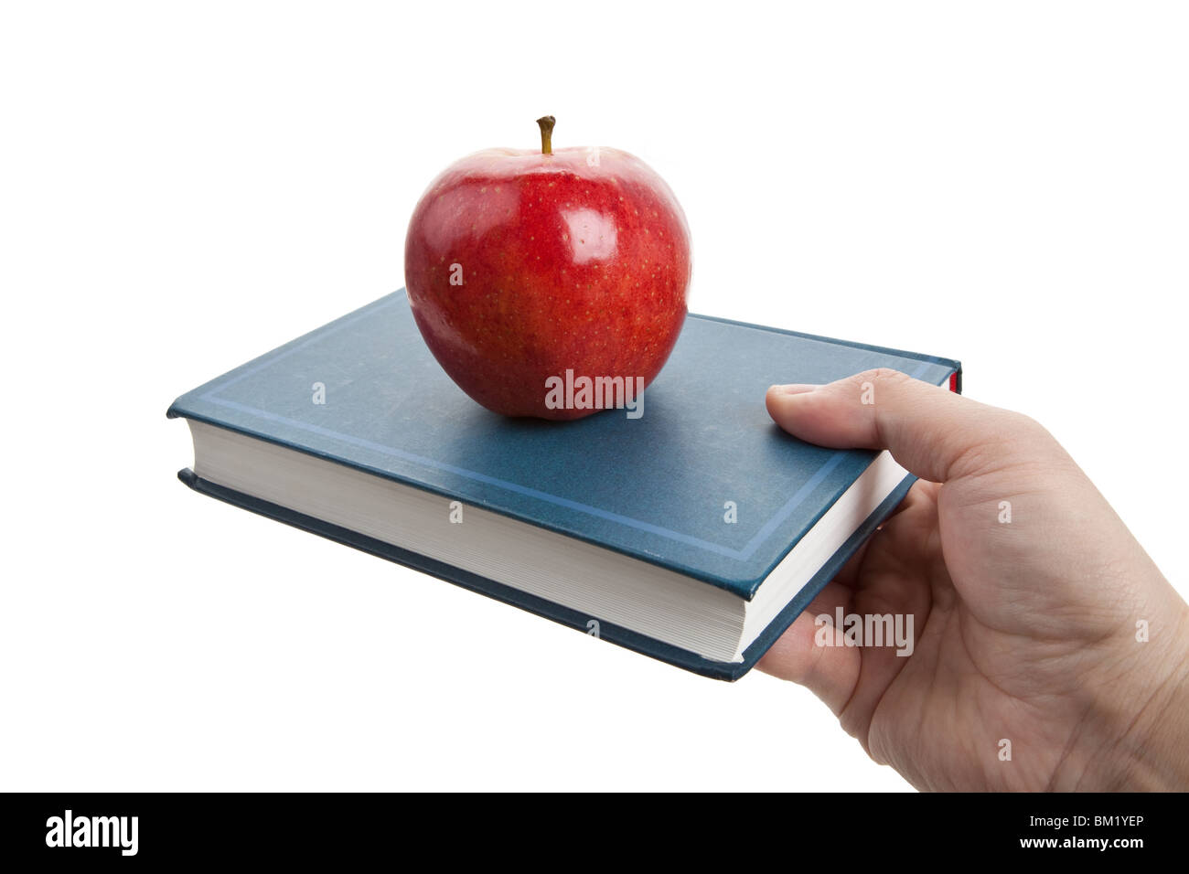 Red apple and book close up Stock Photo - Alamy