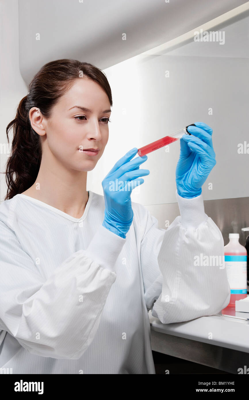 Female doctor holding a medical sample in a laboratory Stock Photo - Alamy